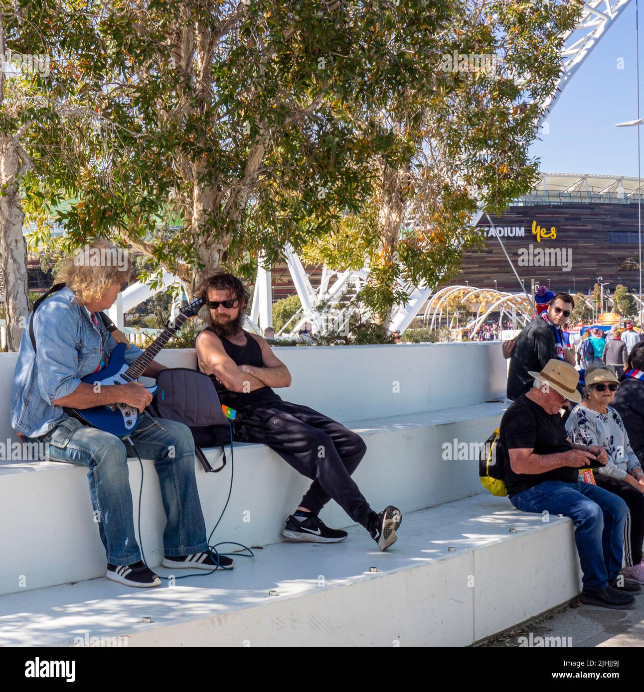 Guitarist busking on the Matagarup Bridge on 2021 AFL Grand Final Day ...