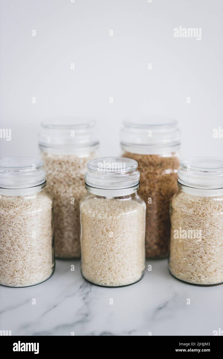 glass jar with rice of different varieties including jasmine basmati ...