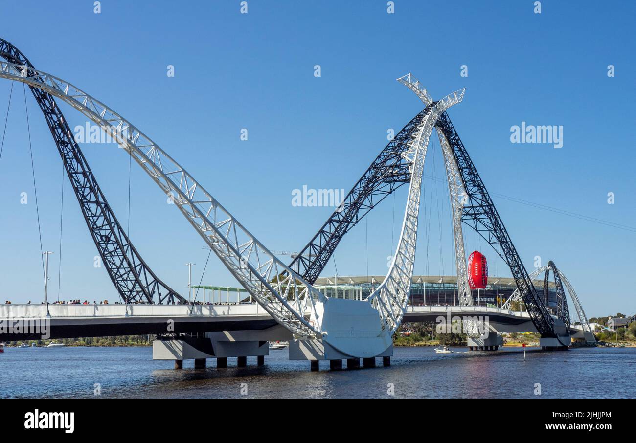 Spectators walking across Matagarup Bridge with a suspended inflatable ...
