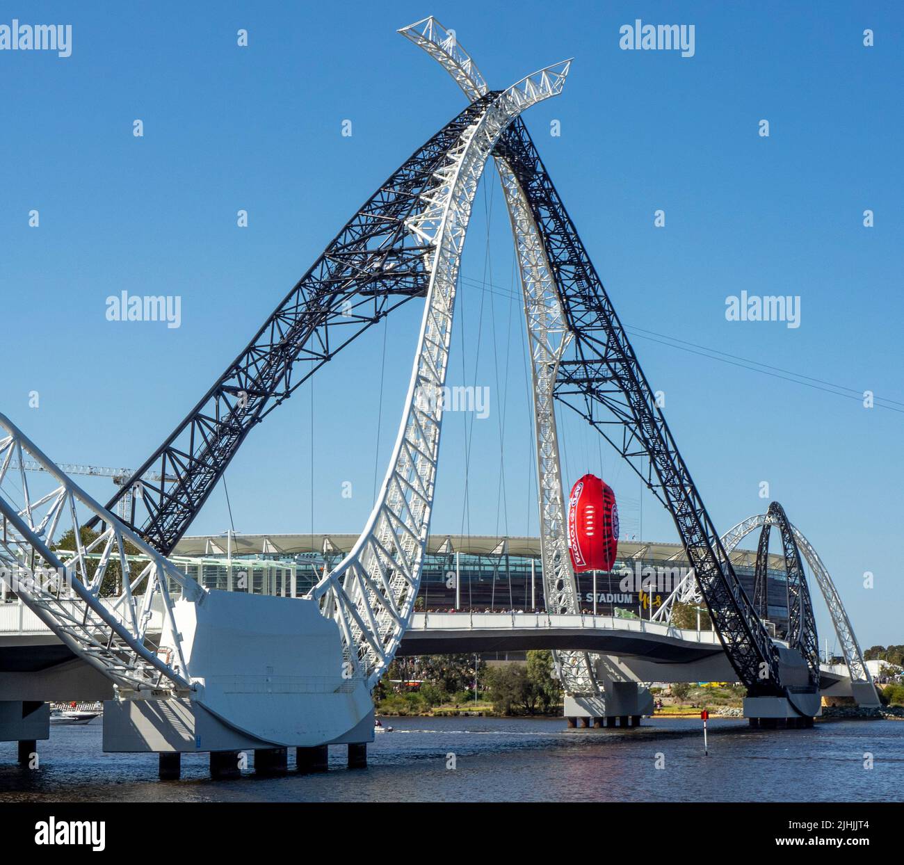 Spectators walking across Matagarup Bridge with a suspended inflatable ...