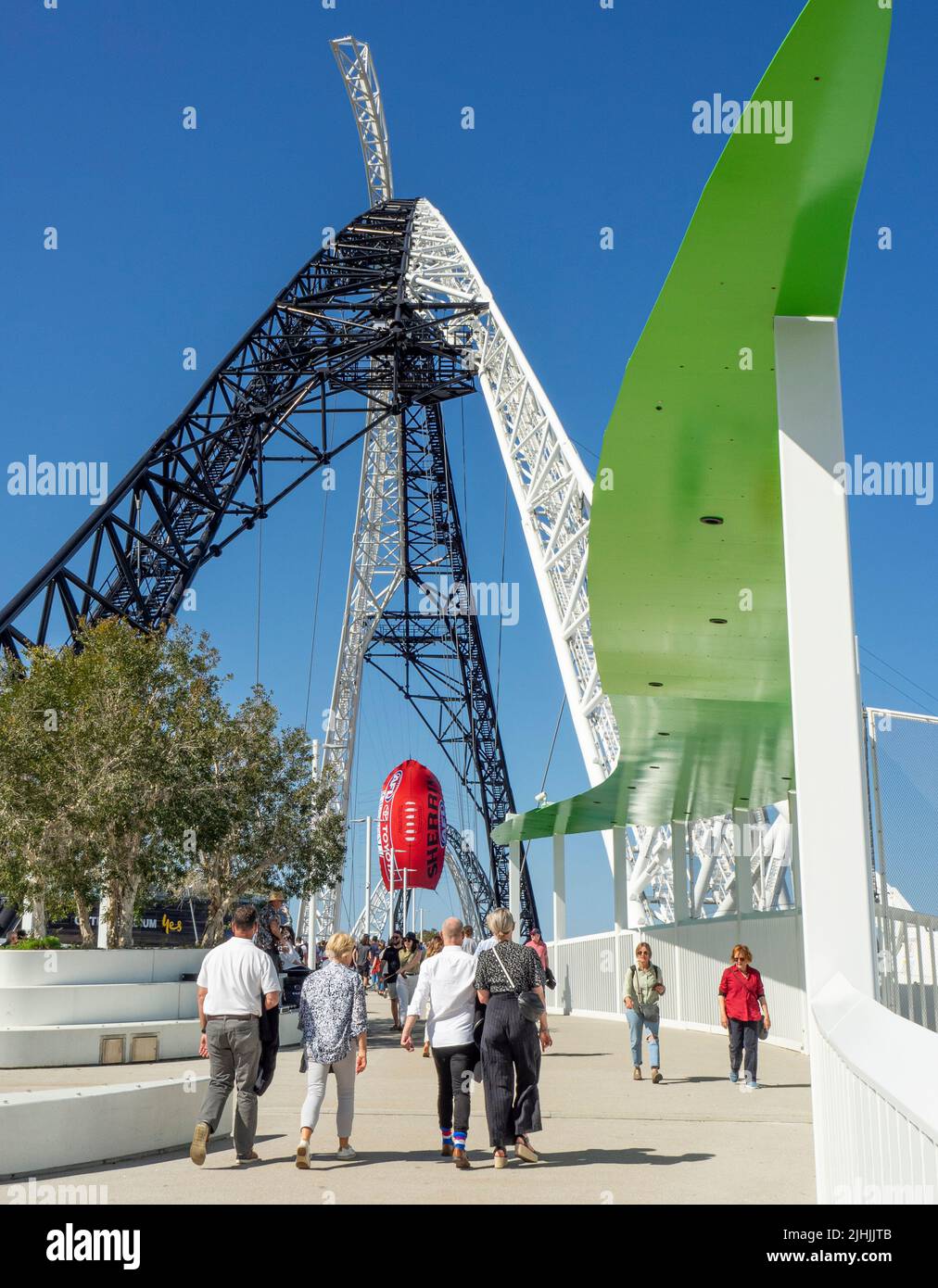 Spectators walking across Matagarup Bridge with a suspended inflatable ...