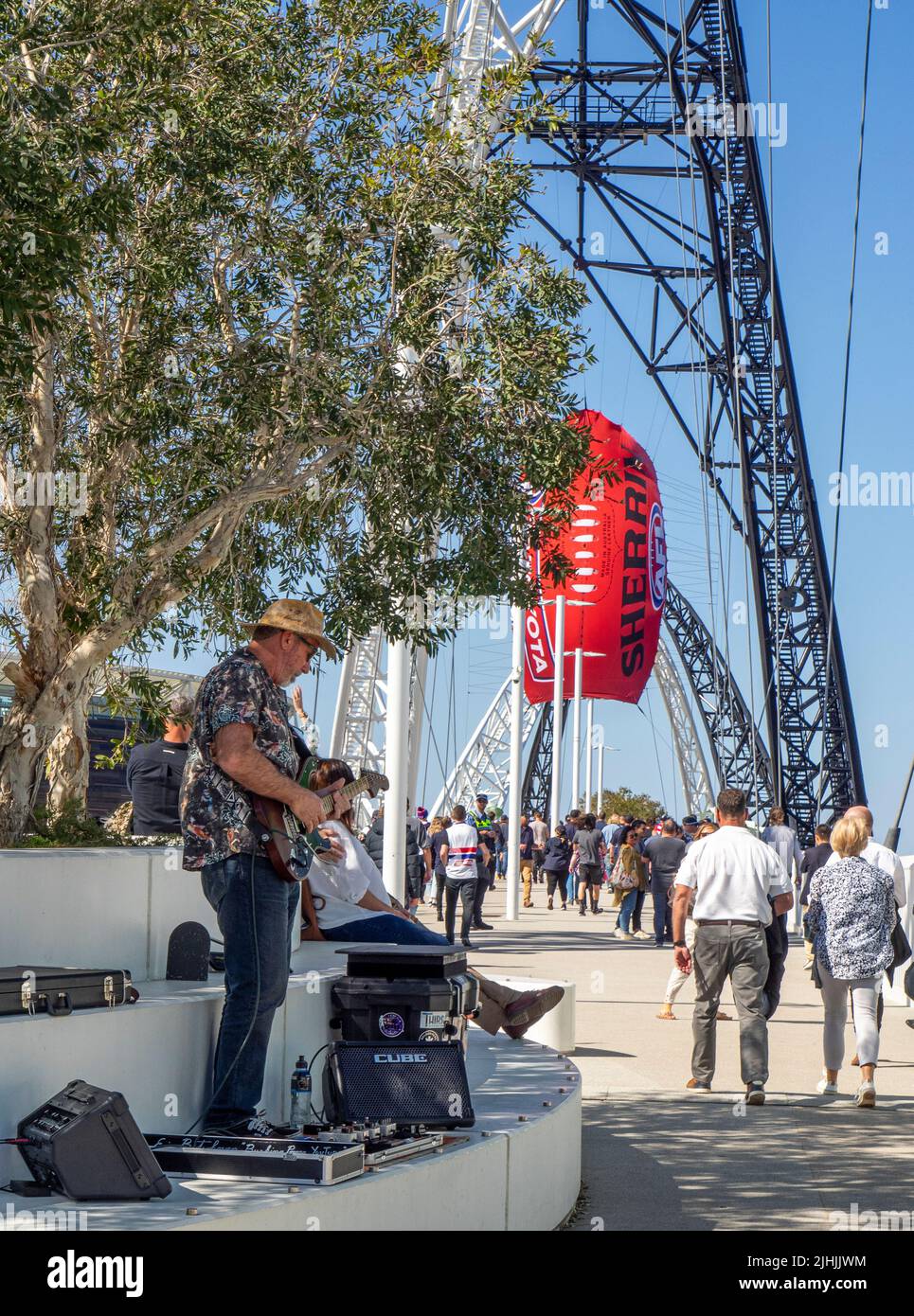 Spectators walking across Matagarup Bridge with a suspended inflatable ...