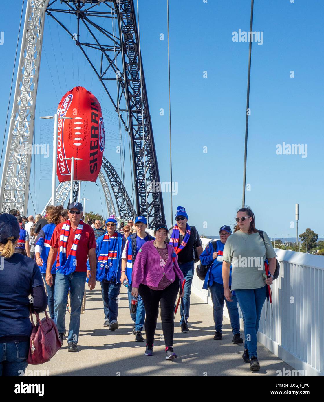 Spectators walking across Matagarup Bridge with a suspended inflatable ...