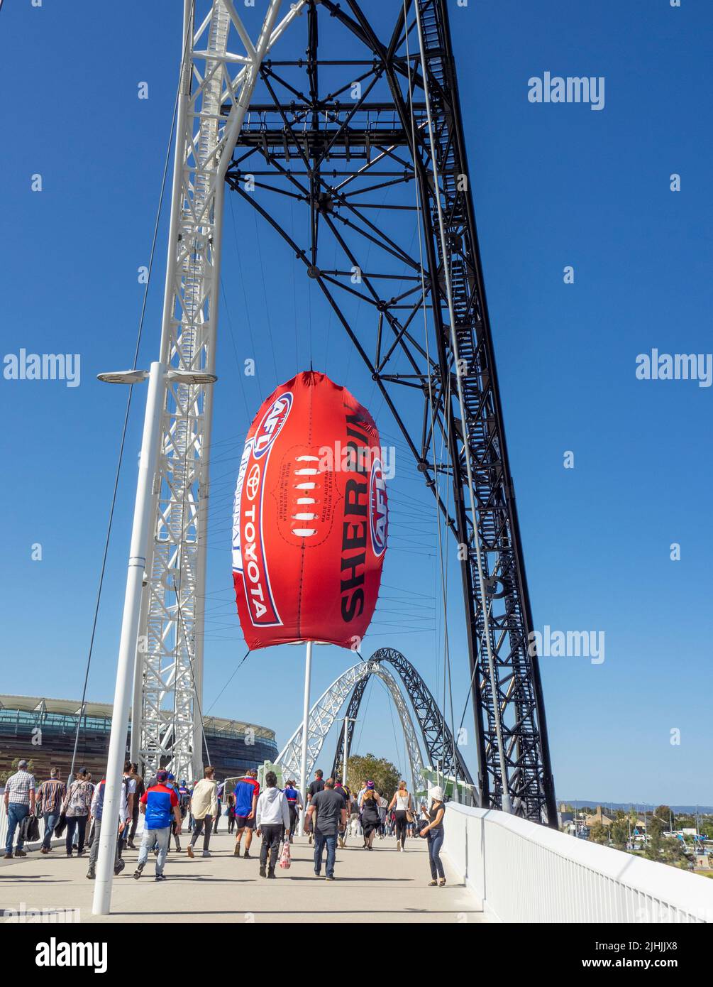 Spectators walking across Matagarup Bridge with a suspended inflatable ...