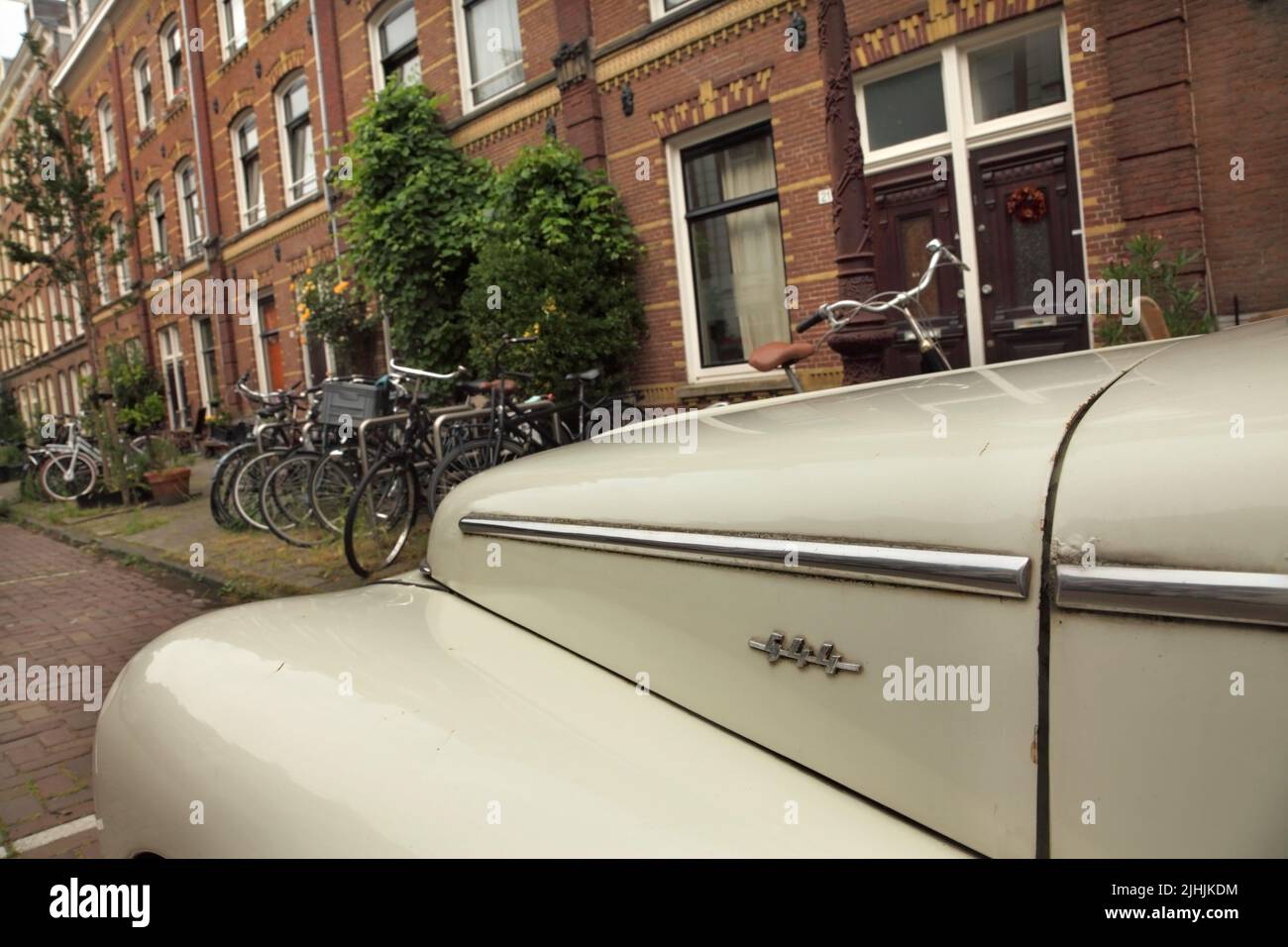 Old Volvo PV544 parked in front of housing in Amsterdam, Netherlands ...
