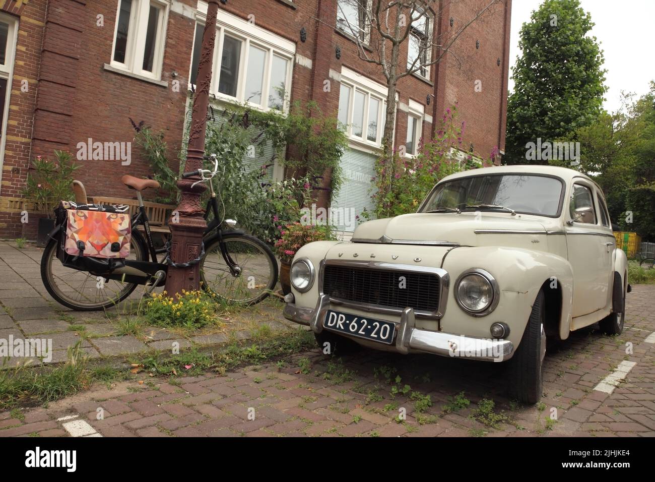 Old Volvo PV544 parked in front of housing in Amsterdam, Netherlands ...