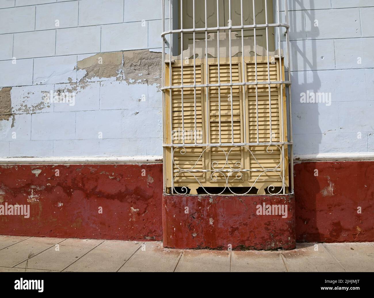 Old Colonial house window with typical handcrafted wrought iron grilles ...