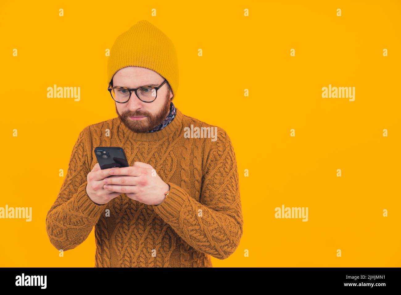 Social media addict checking notifications on his smartphone - news and ...