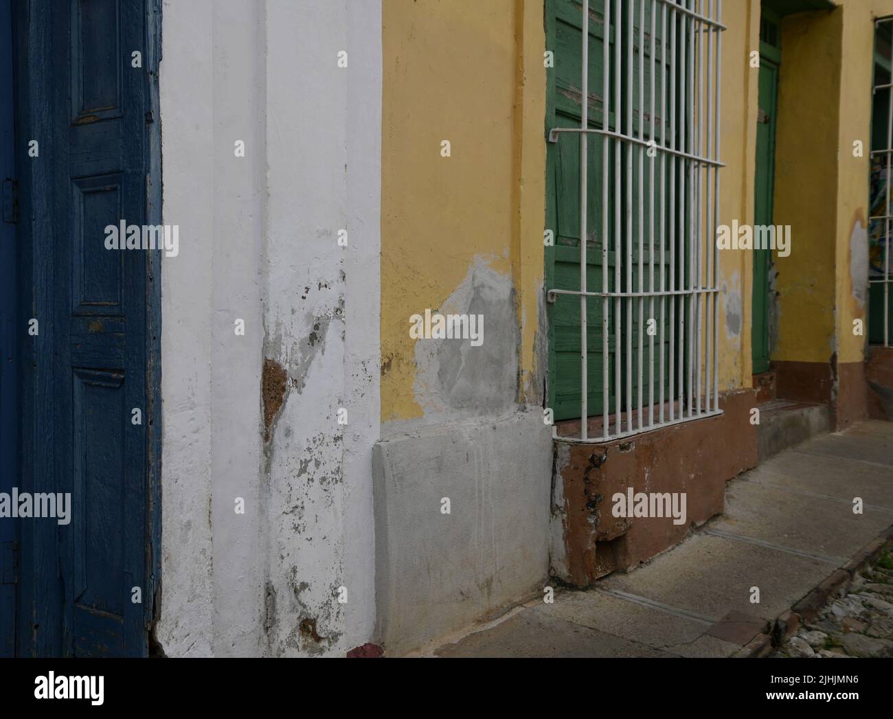 Old Colonial house window with typical handcrafted wrought iron grilles ...