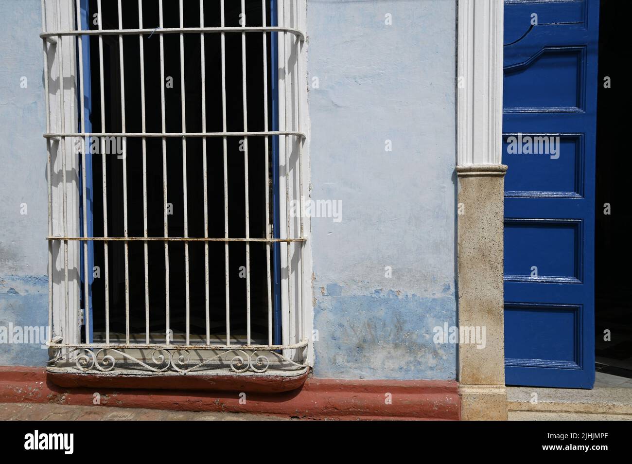 Old Colonial house window with typical handcrafted wrought iron grilles ...