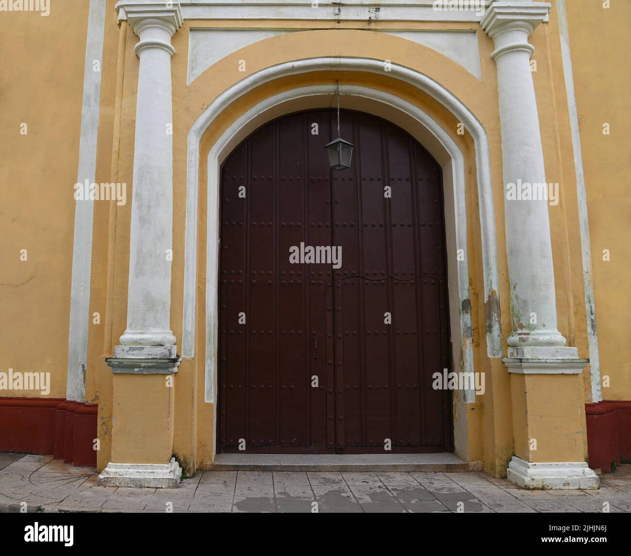 Antique arched wooden door of the Convento de San Francisco de Asís a ...