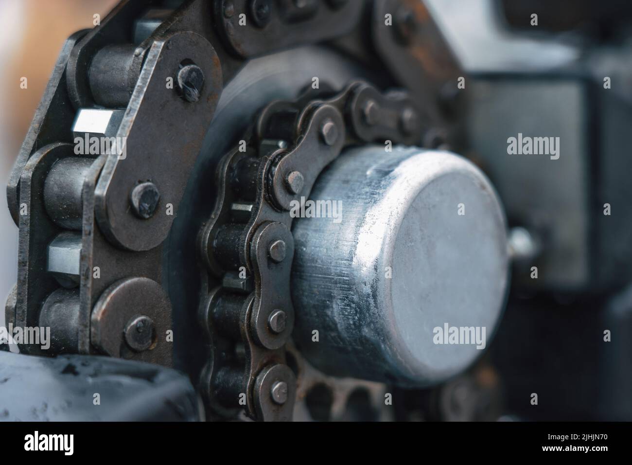 Metal mechanical chain close up on modern agriculture machinery as ...