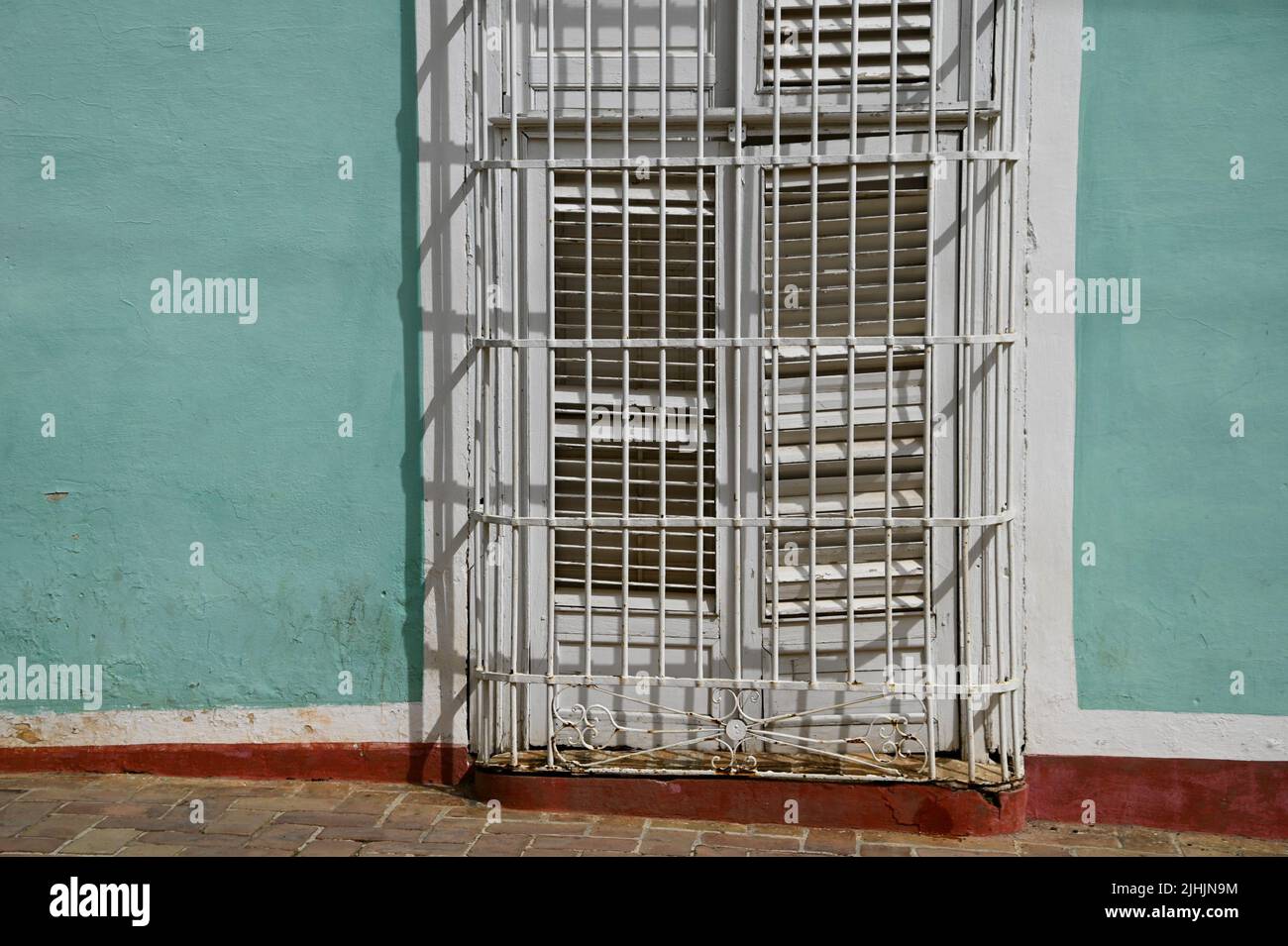 Old Colonial house window with typical handcrafted wrought iron grilles ...