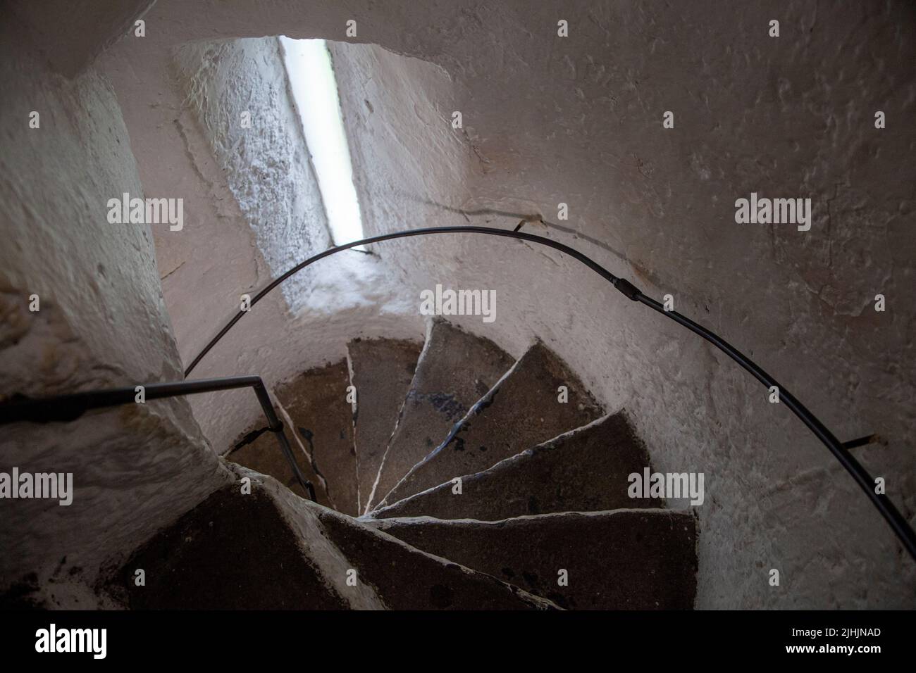 Narrow winding stone staircase Stock Photo - Alamy