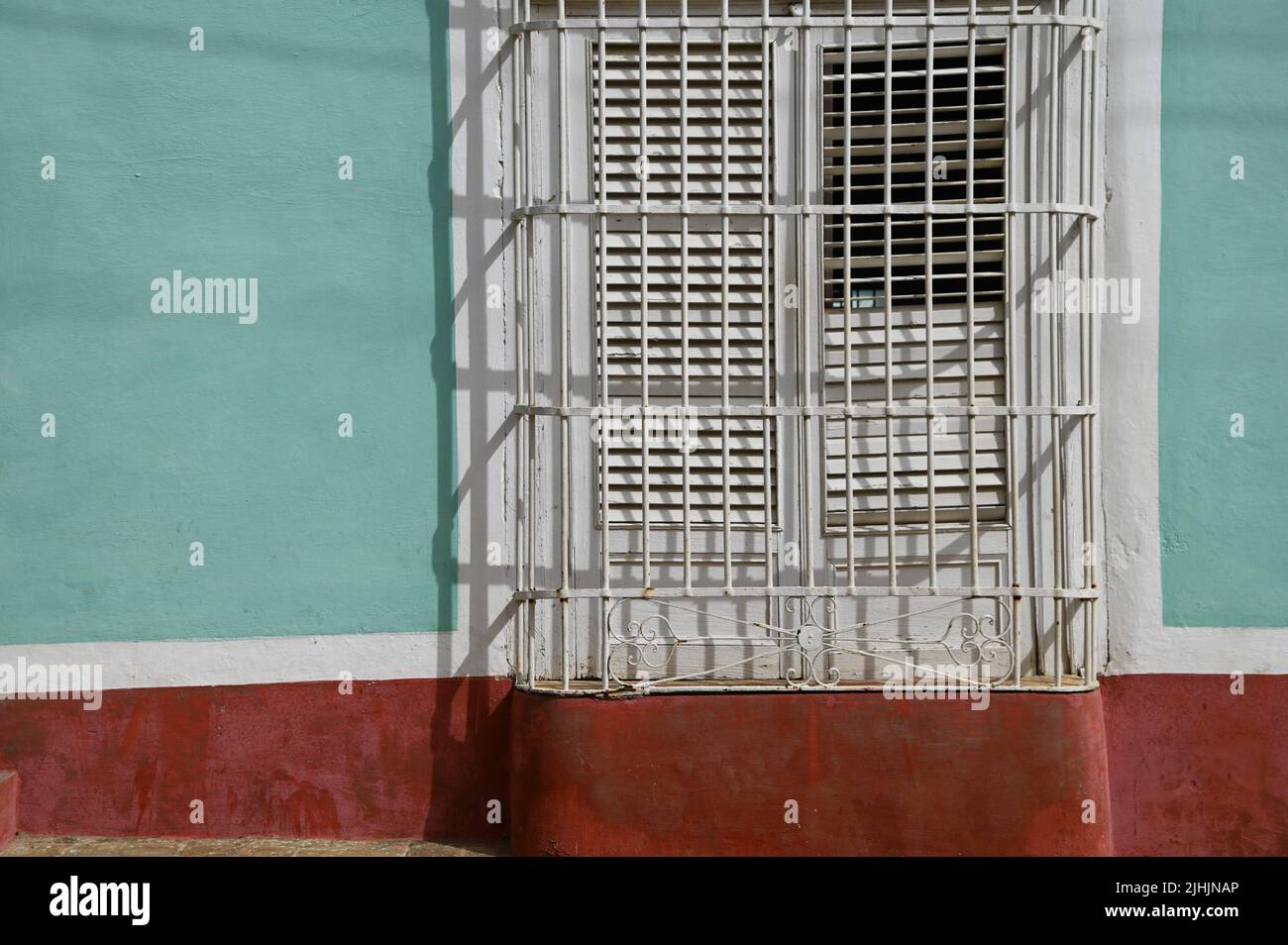 Old Colonial house window with typical handcrafted wrought iron grilles ...