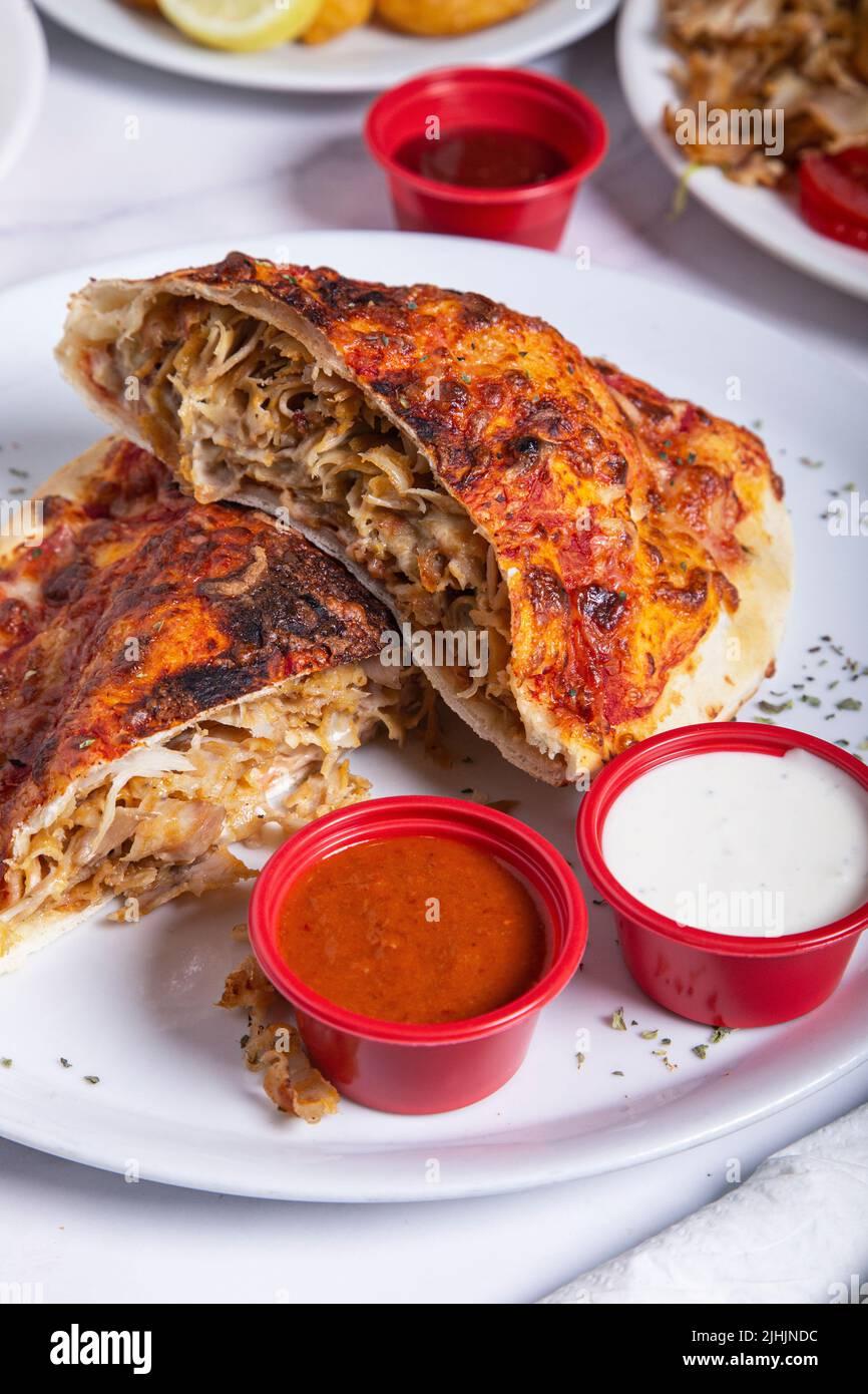 Kebab calzone with various sauces. Fast food Stock Photo - Alamy