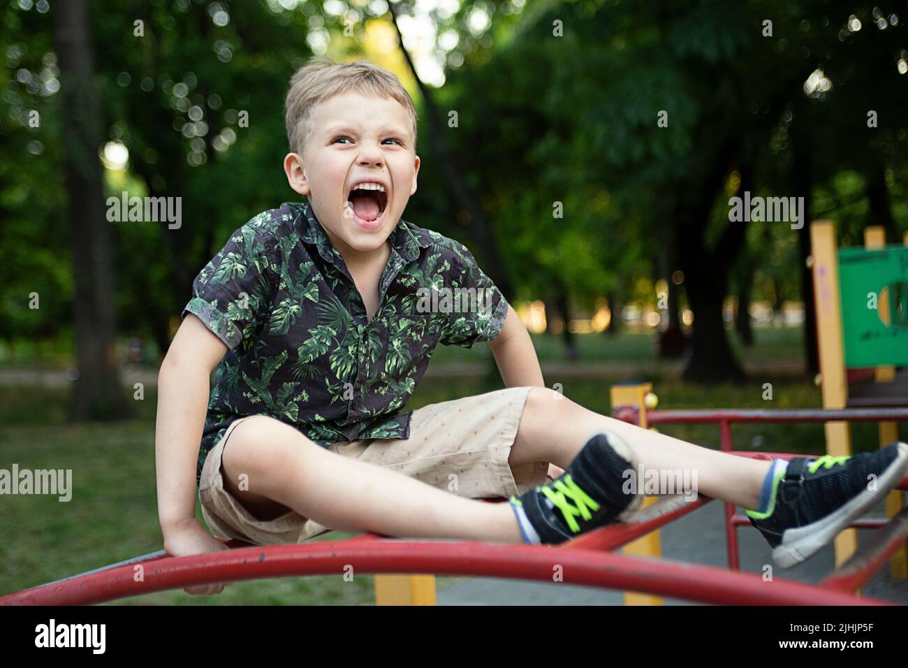 Boy screaming on playground.Concept of emotions Stock Photo - Alamy