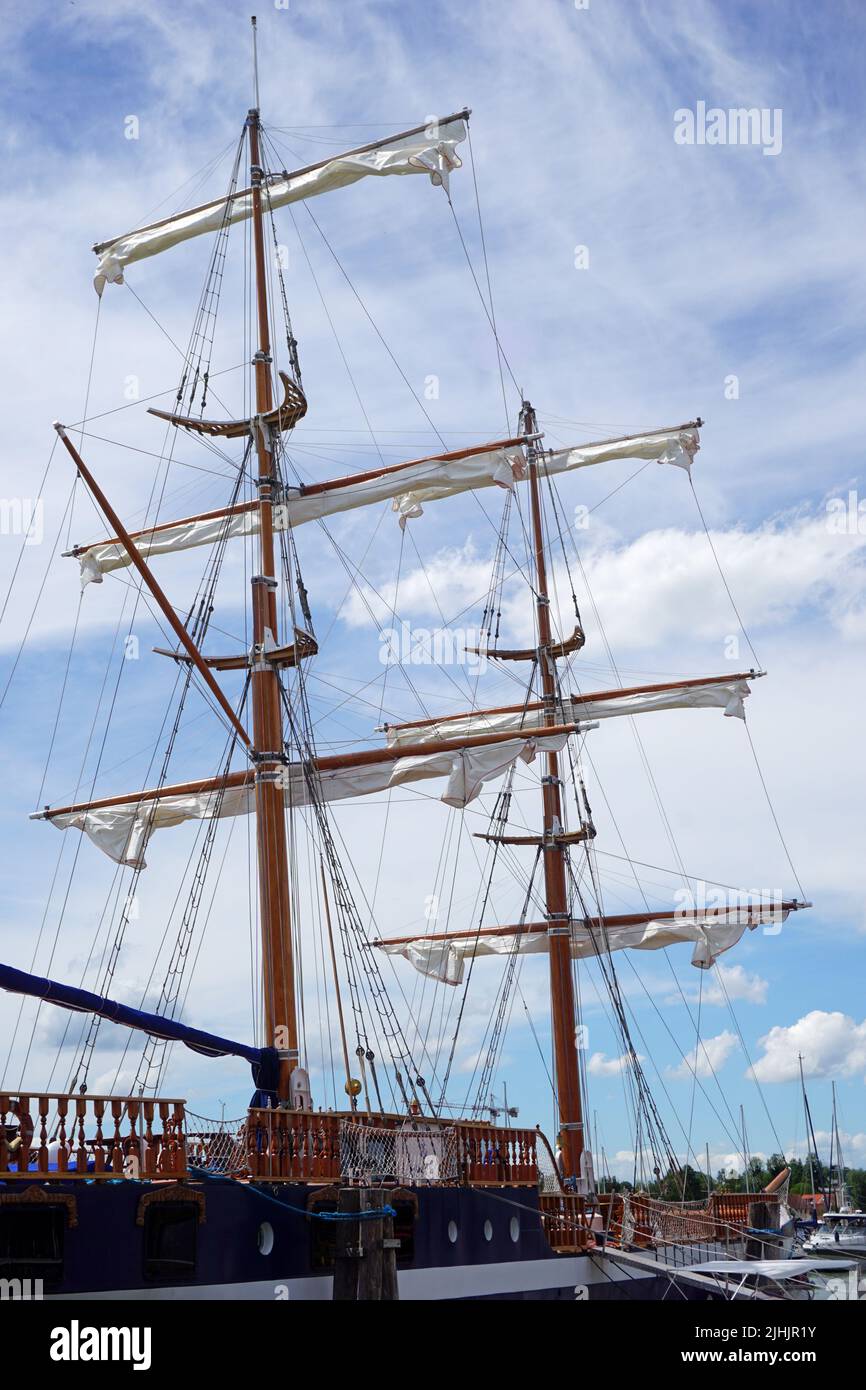 Tall ship mast with rolled sails Stock Photo - Alamy