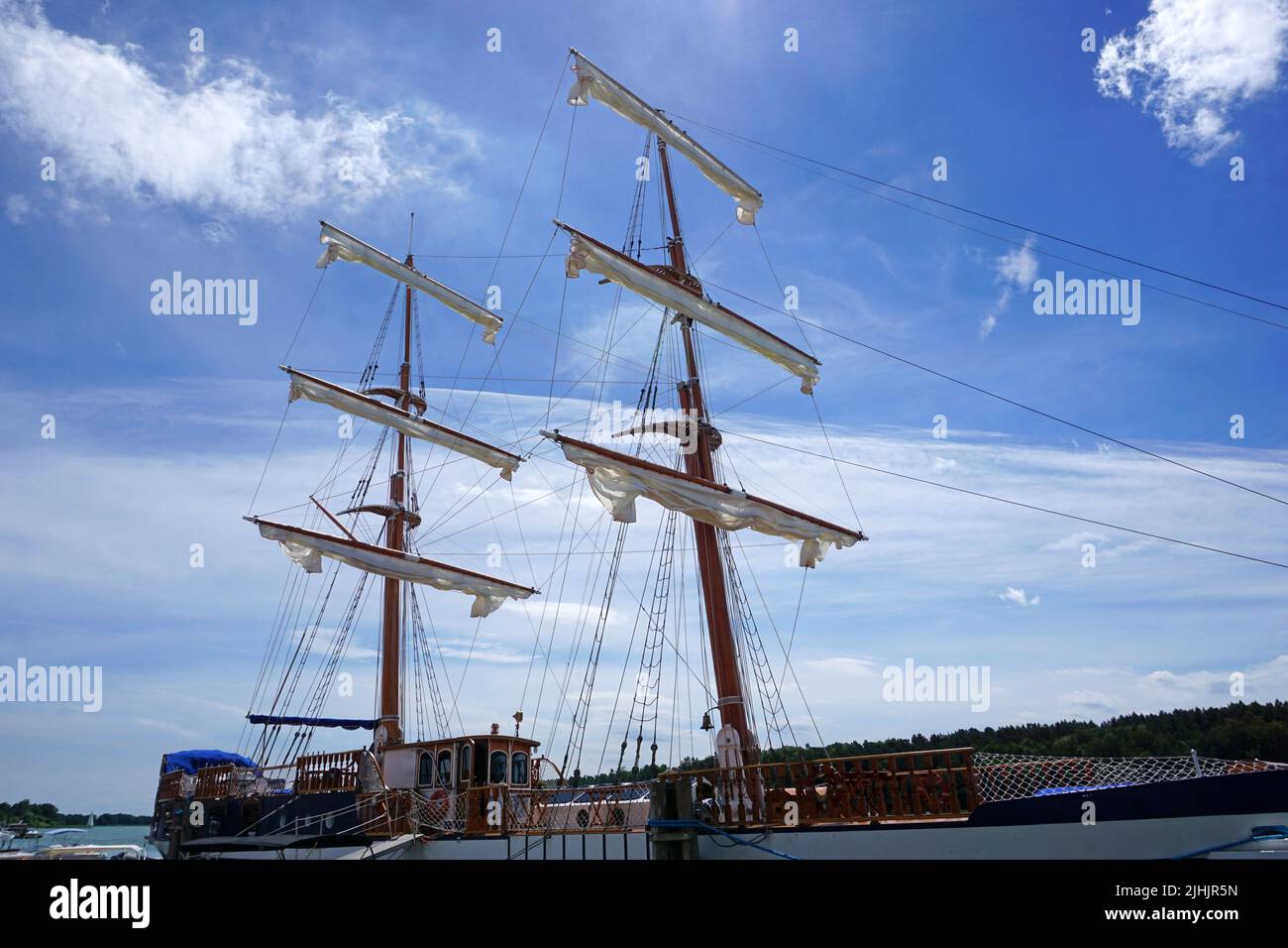 Tall ship mast with rolled sails Stock Photo - Alamy