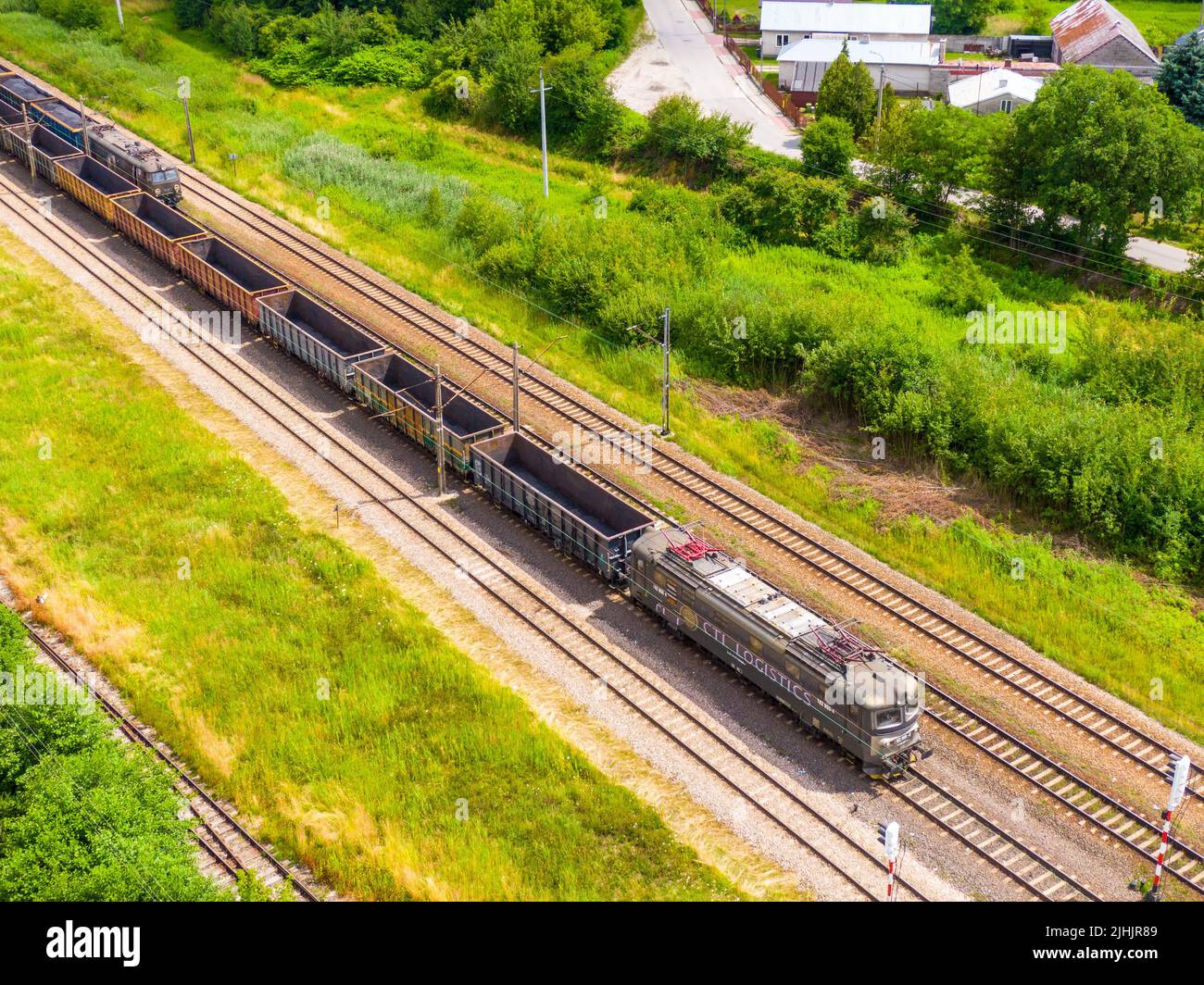 Aerial view of freight train wagons on large railway track field ...