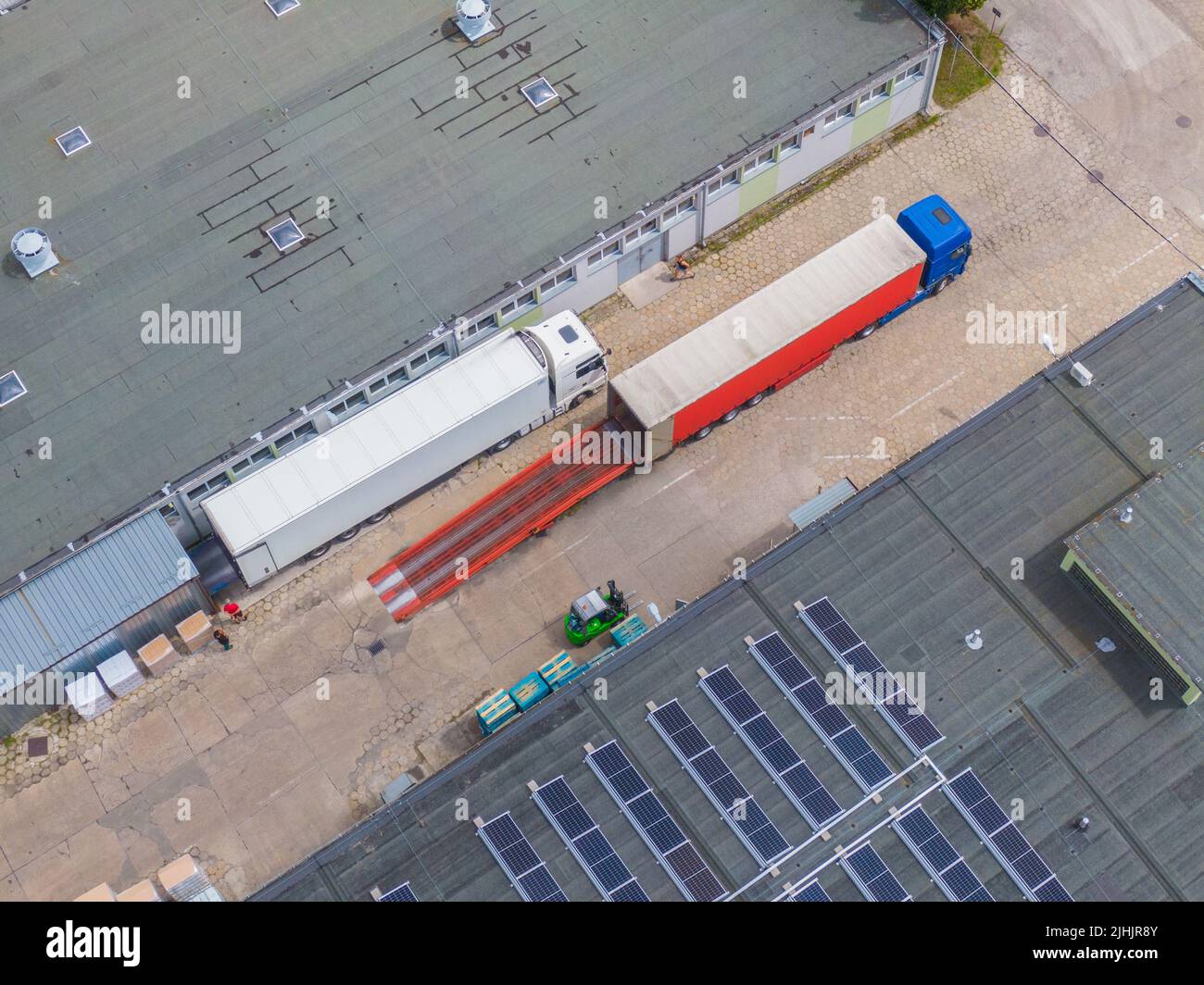Aerial view of goods warehouse. Logistics center delivery in industrial ...