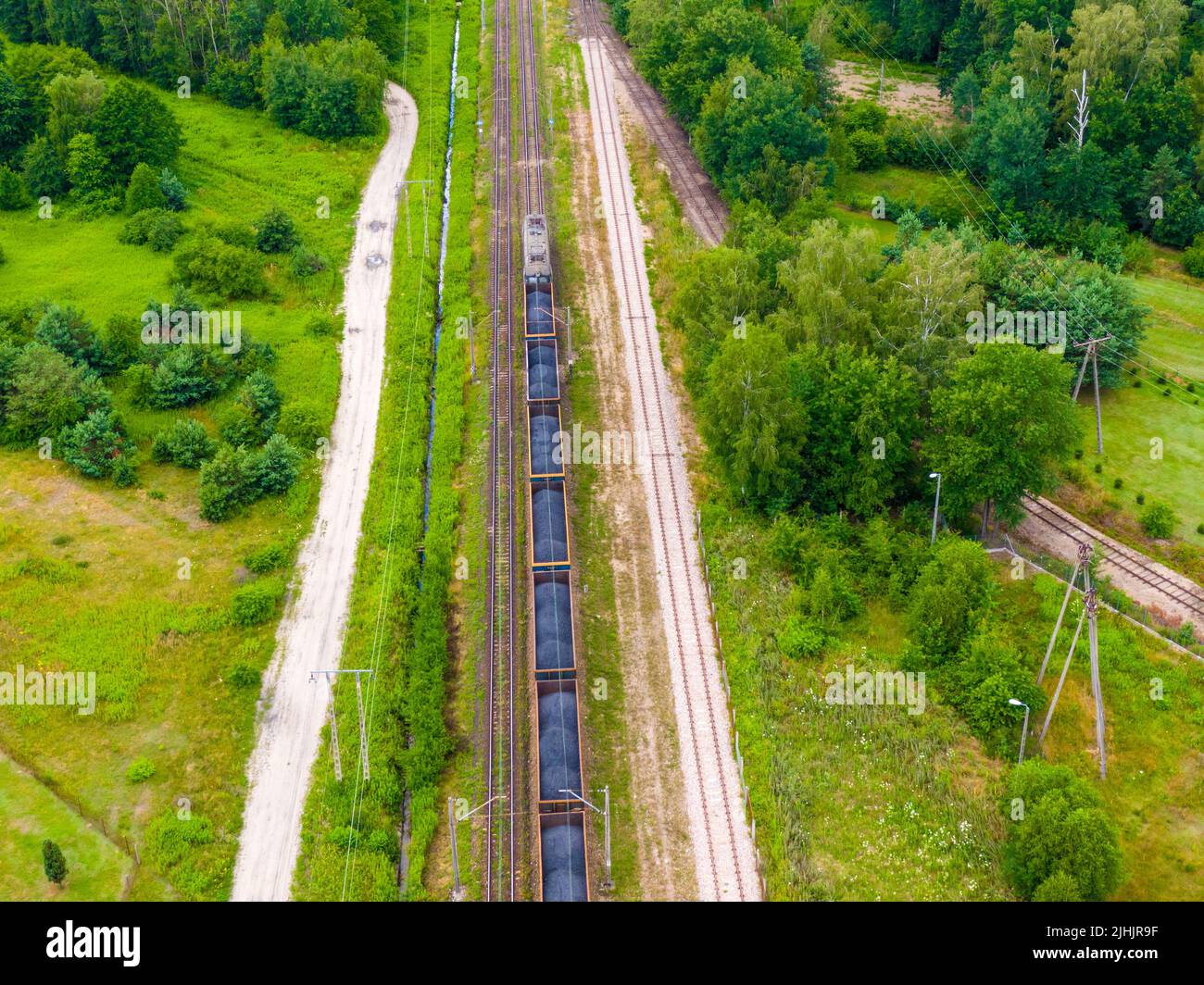 Aerial view of freight train wagons on large railway track field ...