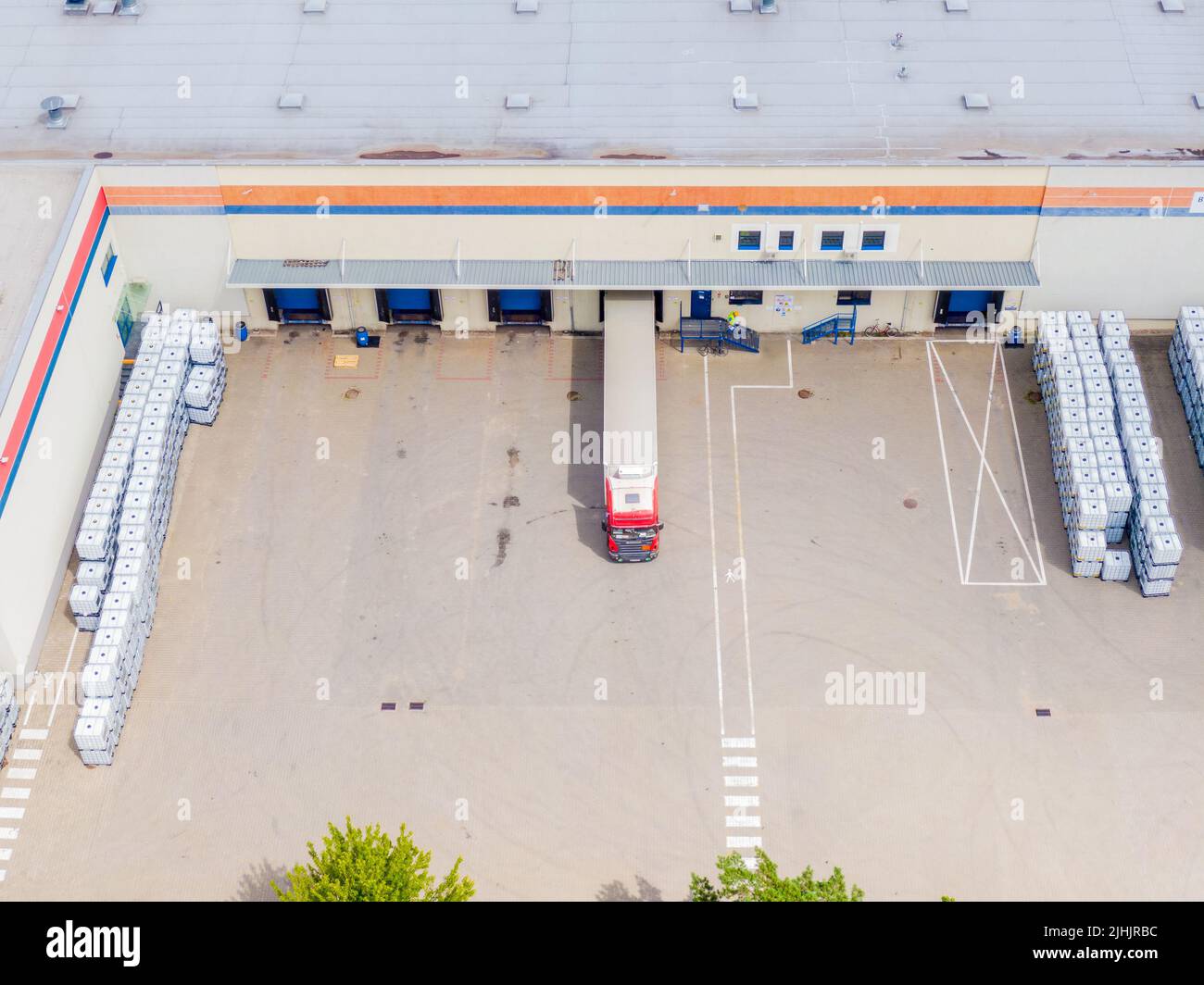 Aerial view of goods warehouse. Logistics center delivery in industrial ...