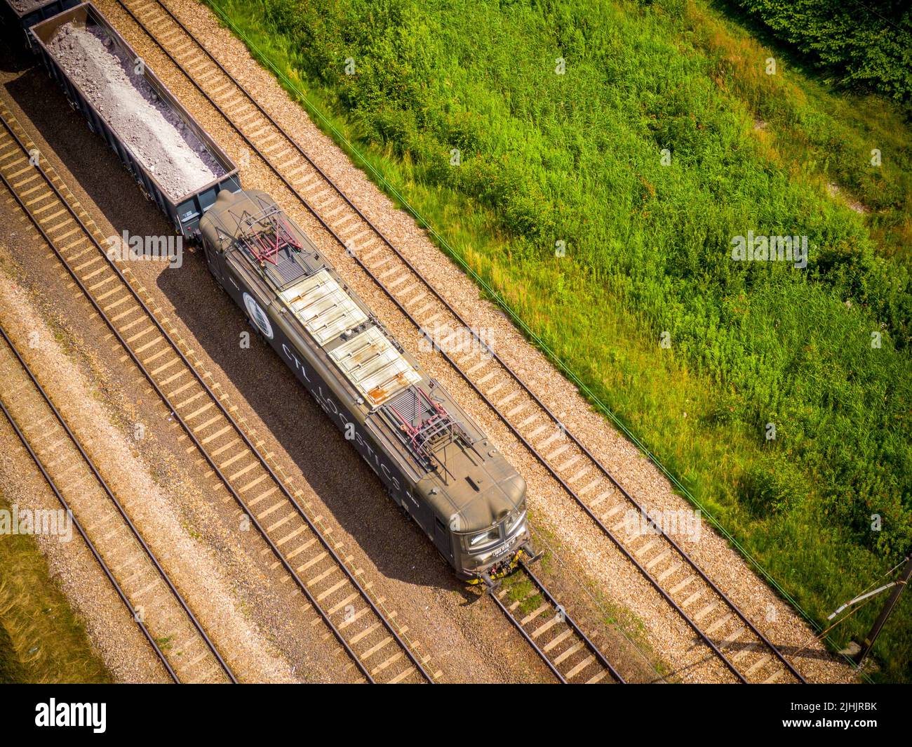 Aerial view of freight train wagons on large railway track field ...