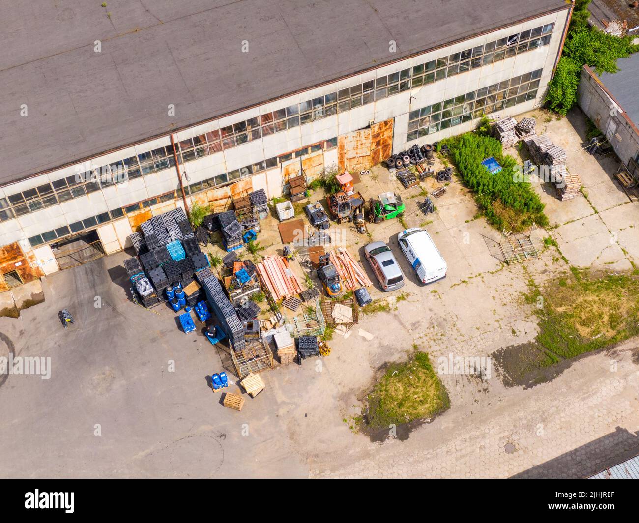 Aerial view of storage with rows of discarded broken cars. Recycling of ...