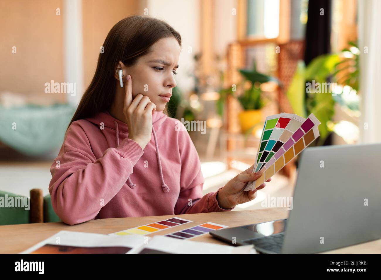 Online design courses. Focused teen girl having online lesson with ...