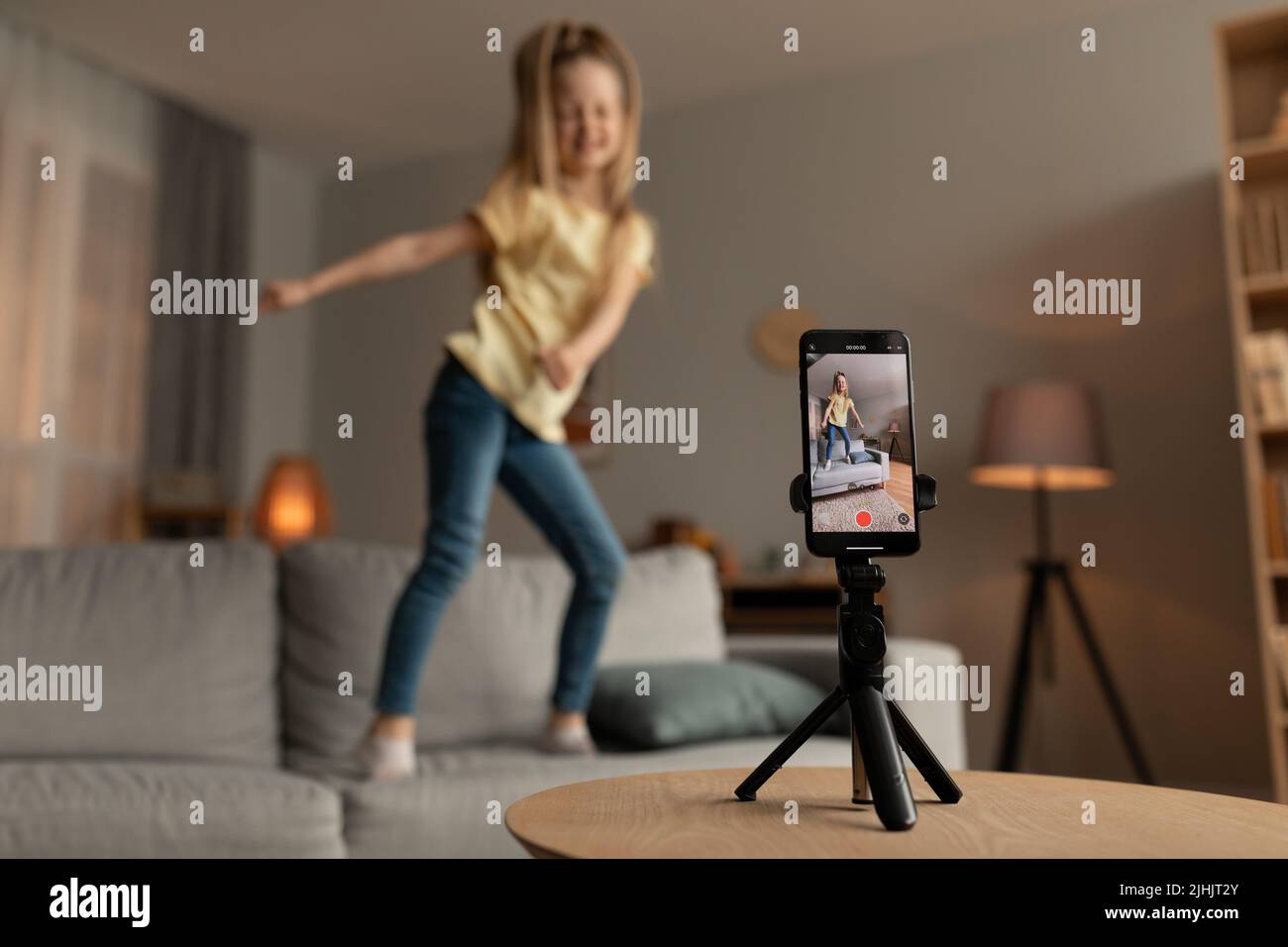 Blogger Kid Girl Dancing Filming On Mobile Phone At Home Stock Photo ...