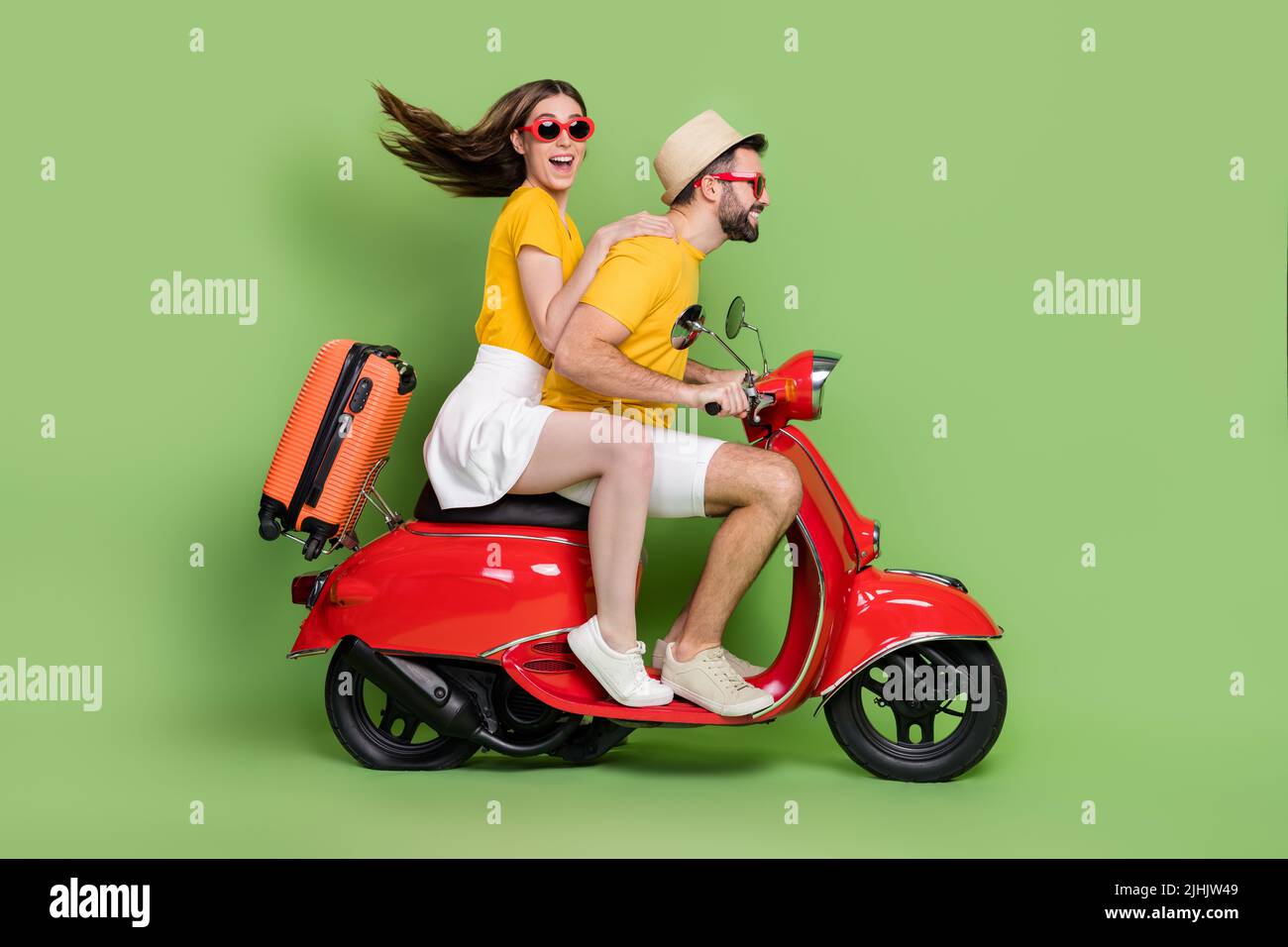Full length profile portrait of two excited partners drive moped ...