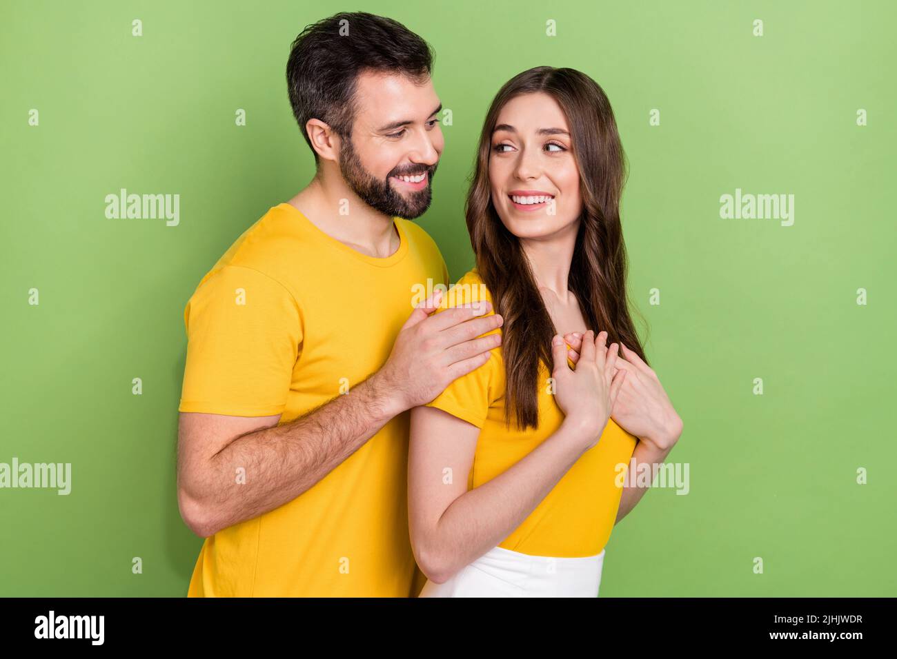 Profile portrait of cheerful two partners hug hands touch shoulders ...