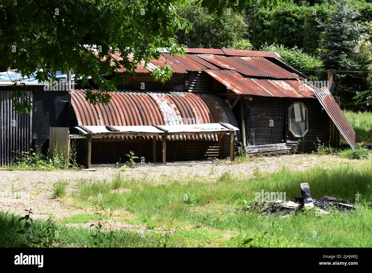 Rusty buildings alongside the beautiful Basingstoke Canal in Surrey ...