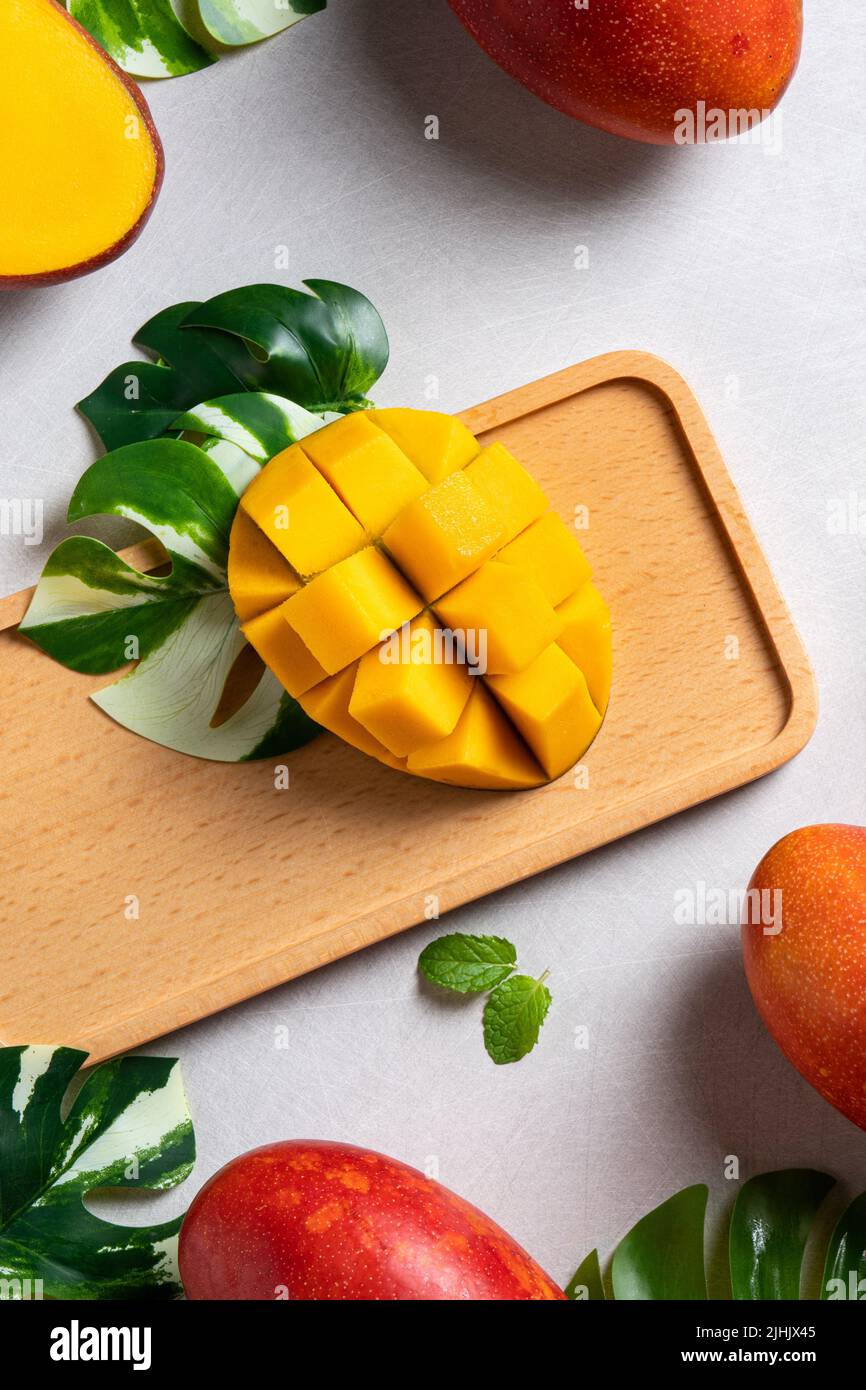 Mango background design concept. Top view of diced fresh mango fruit ...