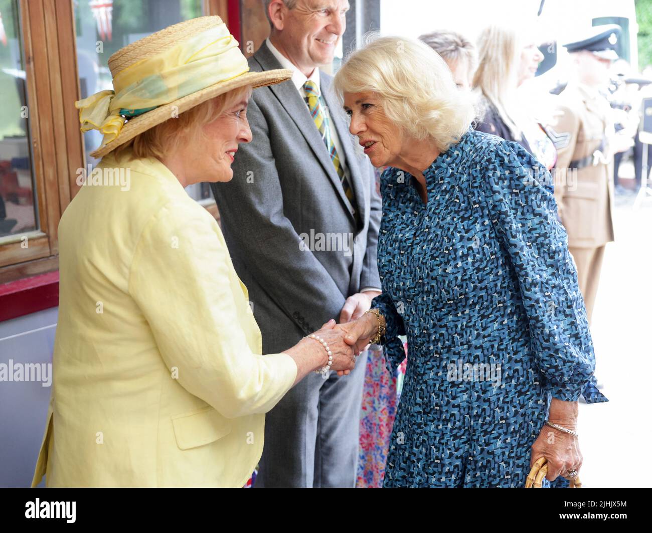 The Duchess of Cornwall shakes hands with Dame Esther Rantzen (left ...