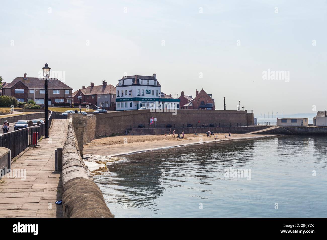 The beach and sea wall at Hartlepool Headland, England, UK with the Pot ...
