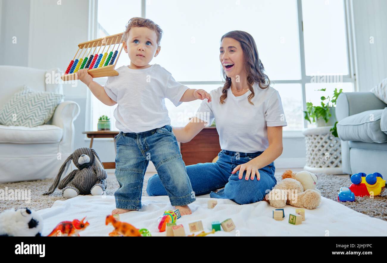 He loves all of his toys. Full length shot of an adorable little boy ...