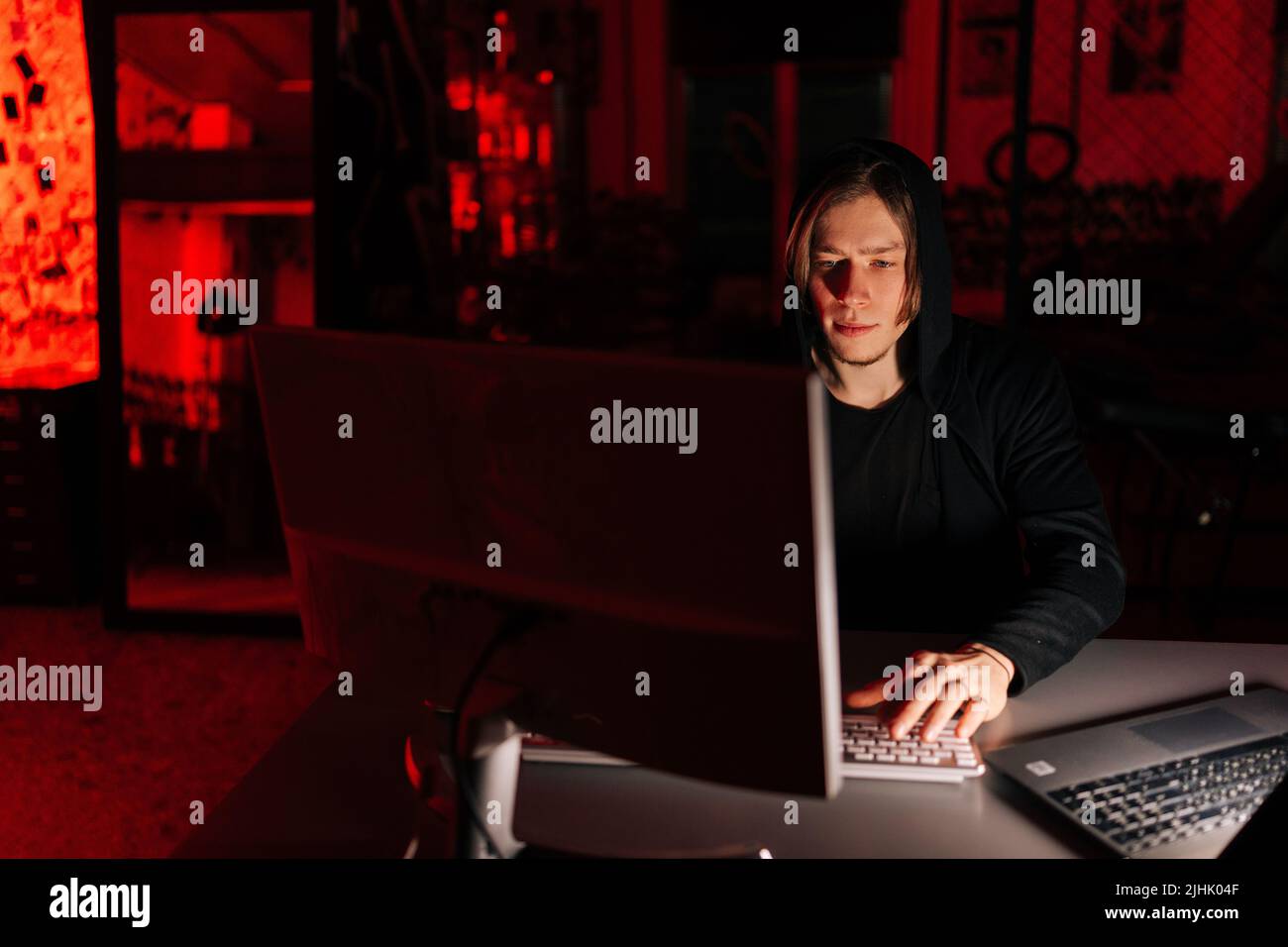 Portrait of wanted hacker man stealing information, preparing to break ...