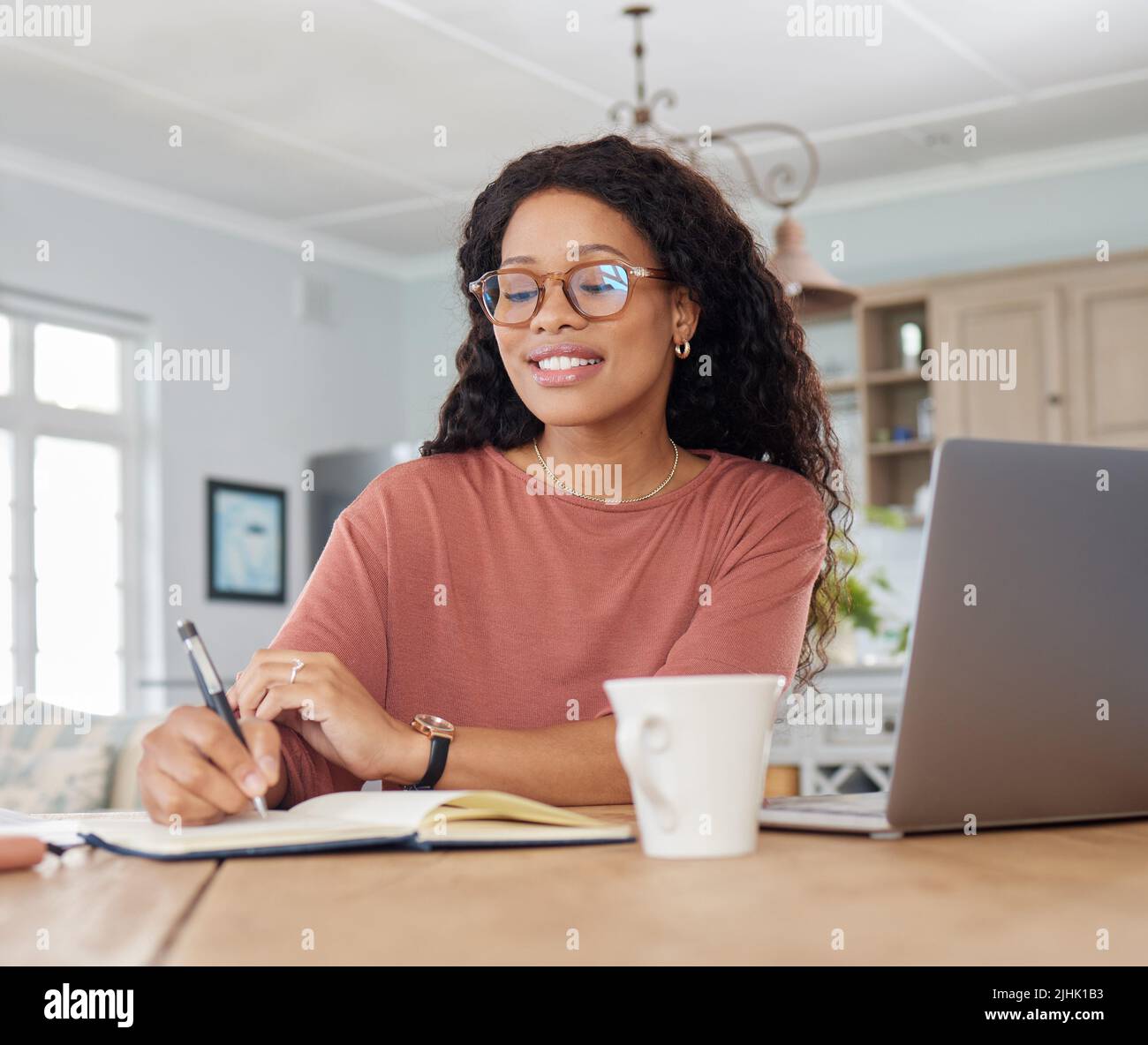 Woman writing notes hi-res stock photography and images - Alamy