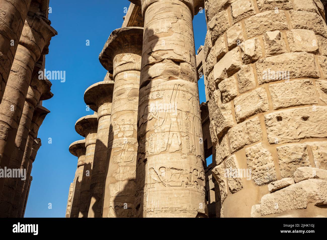 Different hieroglyphs on the walls and columns in the Karnak temple. Karnak temple is the ...