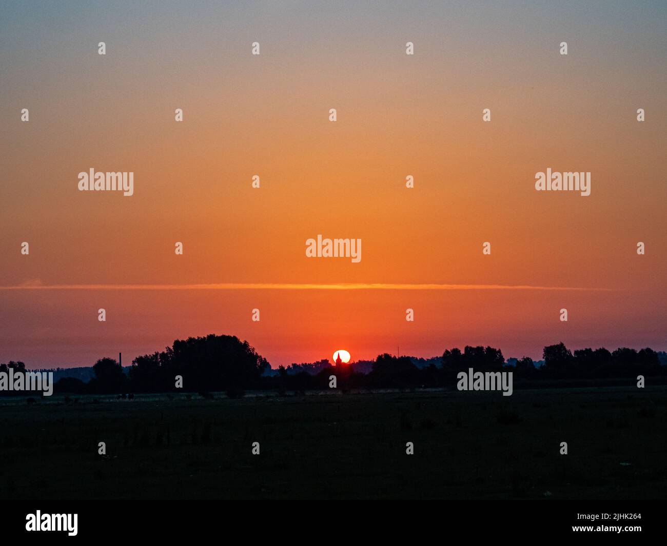 The Netherlands, 17/07/2022, The first rays of sunlight are seen ...