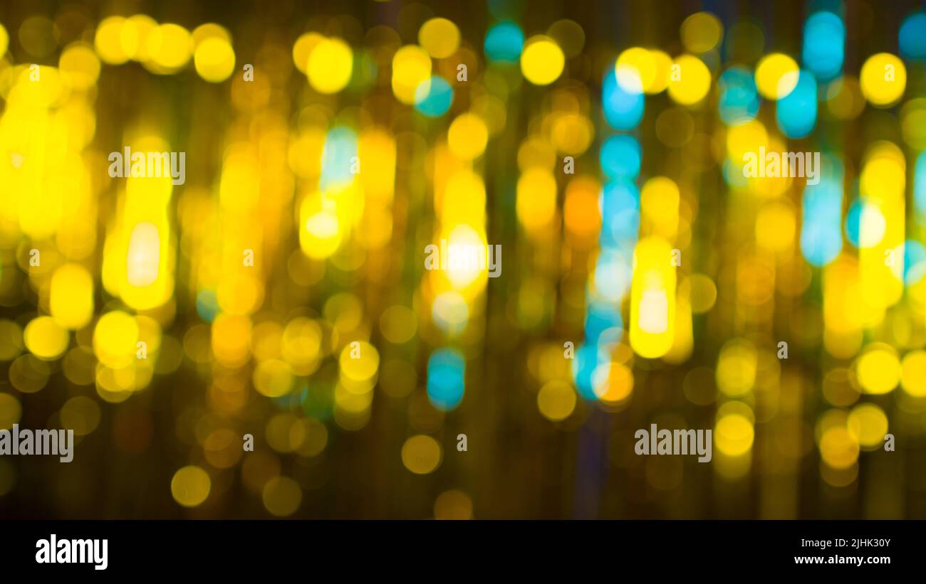 Shiny defocused abstract background of bright lights of garland glowing ...