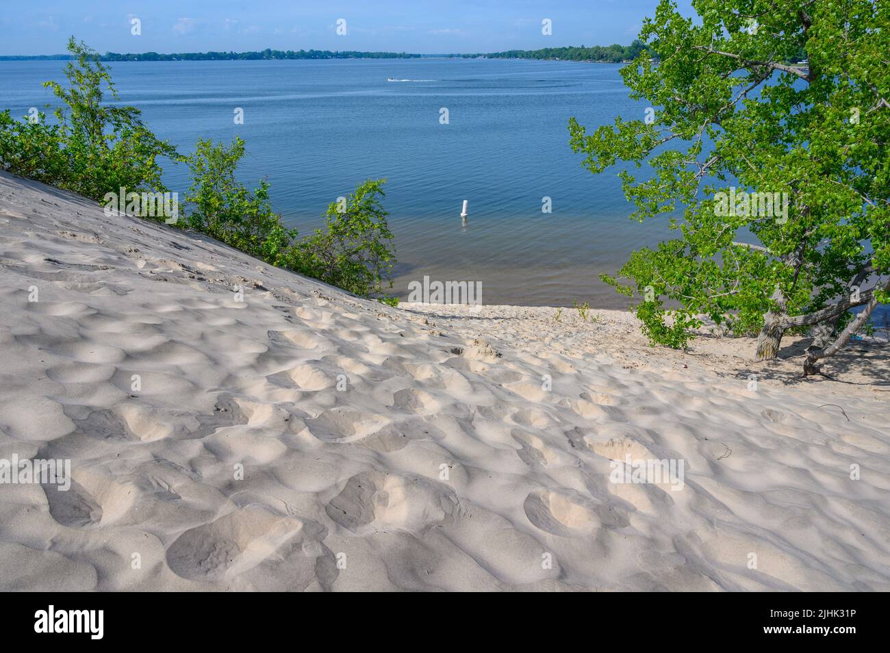 View across West Lake, with a water scooter speeding on the water, from ...