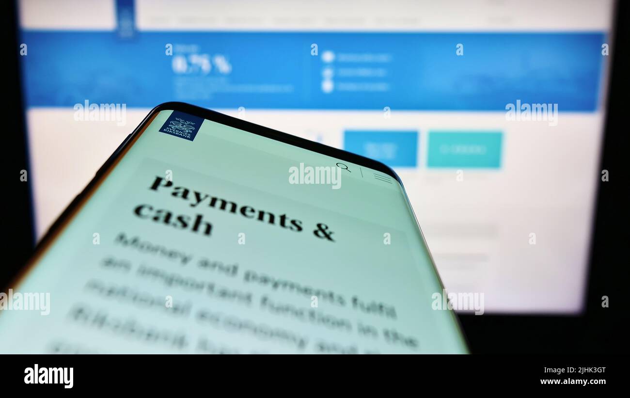Smartphone with web page and logo of Swedish central bank Sveriges ...