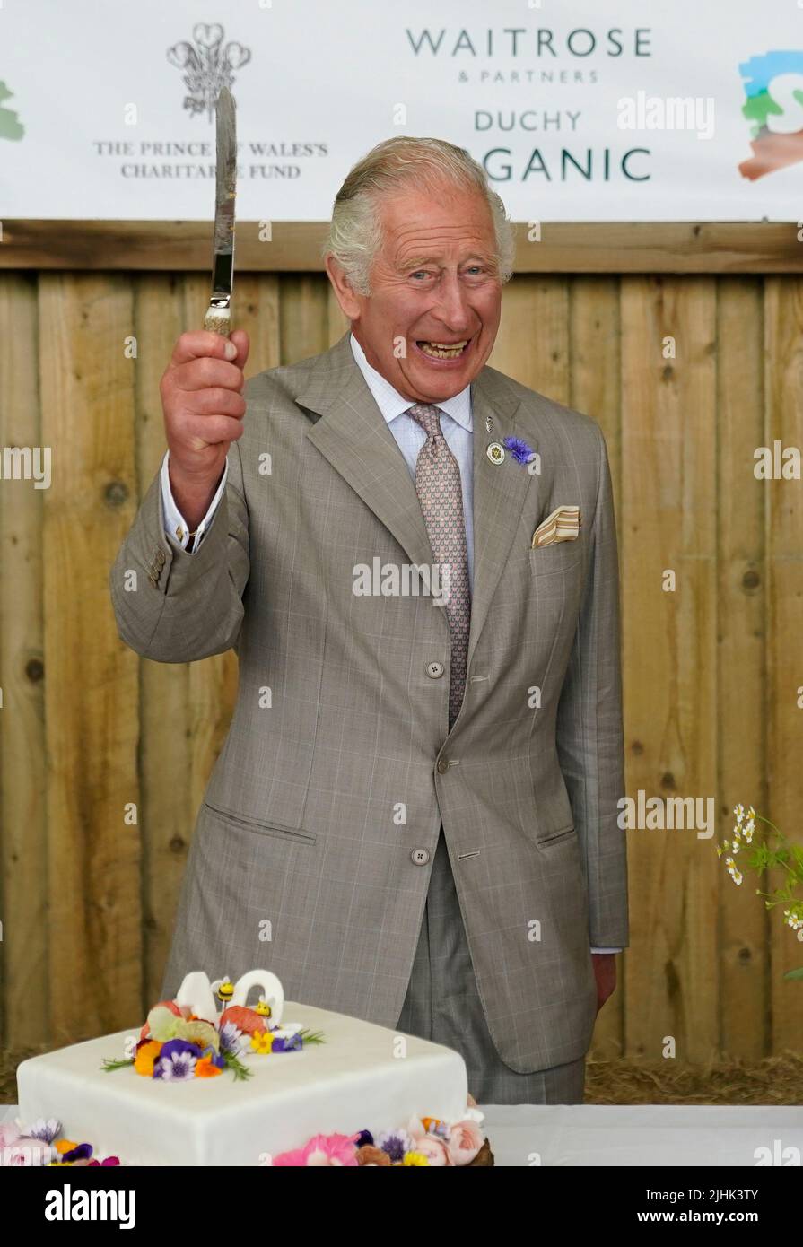 The Duke of Cornwall cuts a celebratory cake as he attends the ...