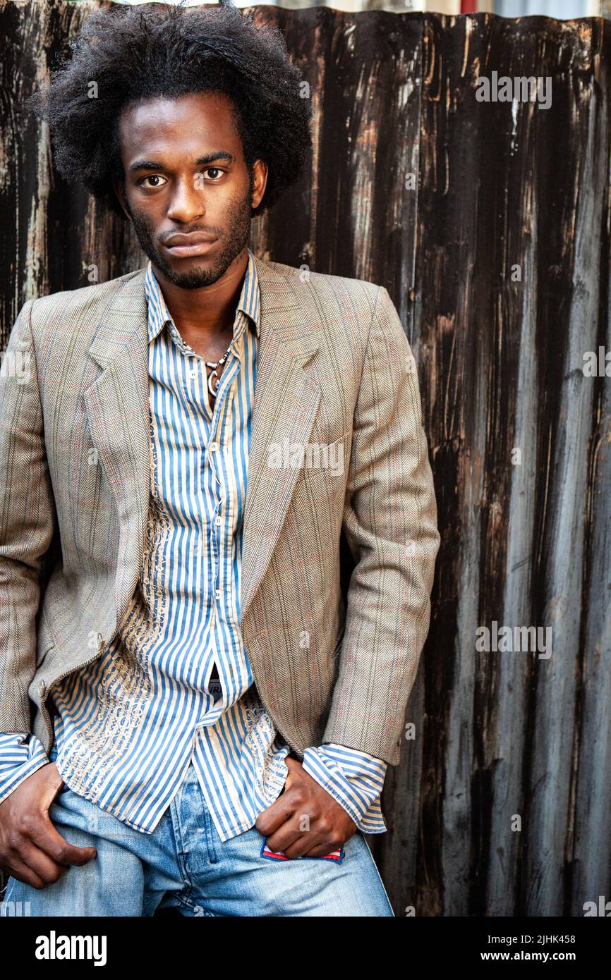 Urban Fashion. A confident fashion pose from a casually dressed young ...