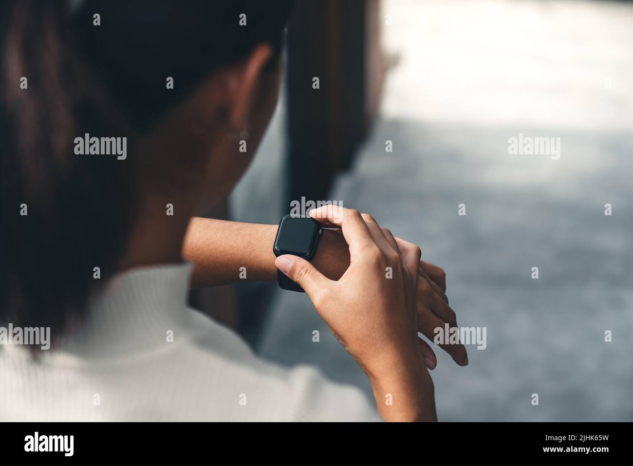 Active woman using smartwatch monitor hi-res stock photography and ...