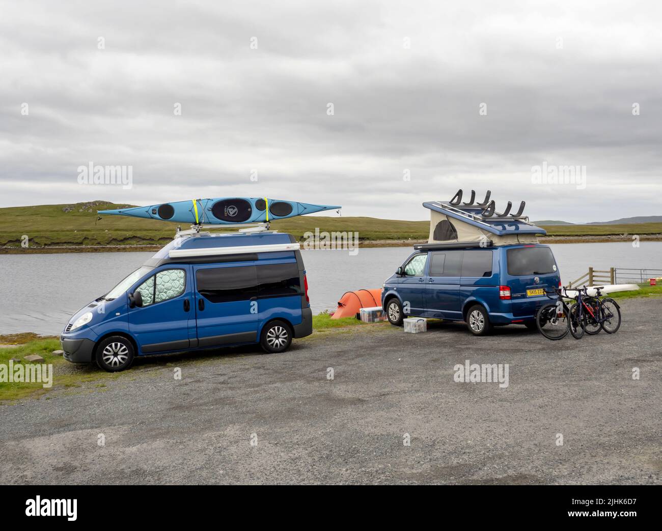 Camper vans on a campsite at the harbour in Burravoe, Yell, Shetland ...