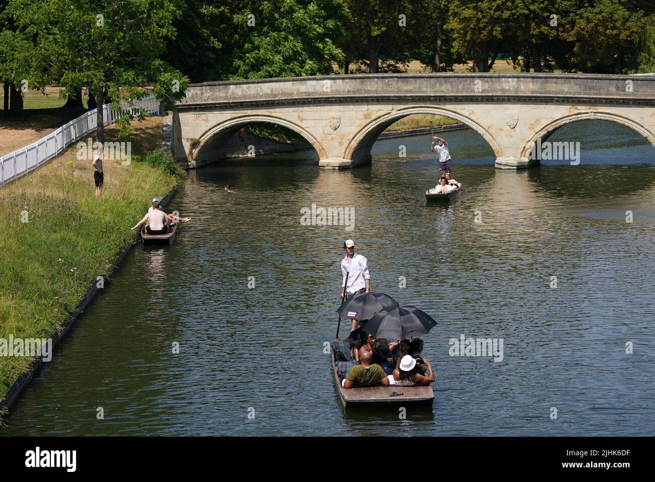 People being punted along the River Cam in Cambridge, one of the ...